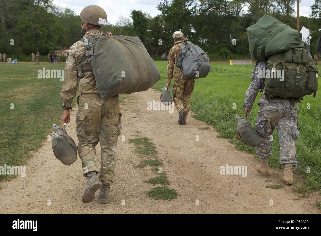 A group of U.S. Army and Partner Nations walk towards chute shakeout on ...