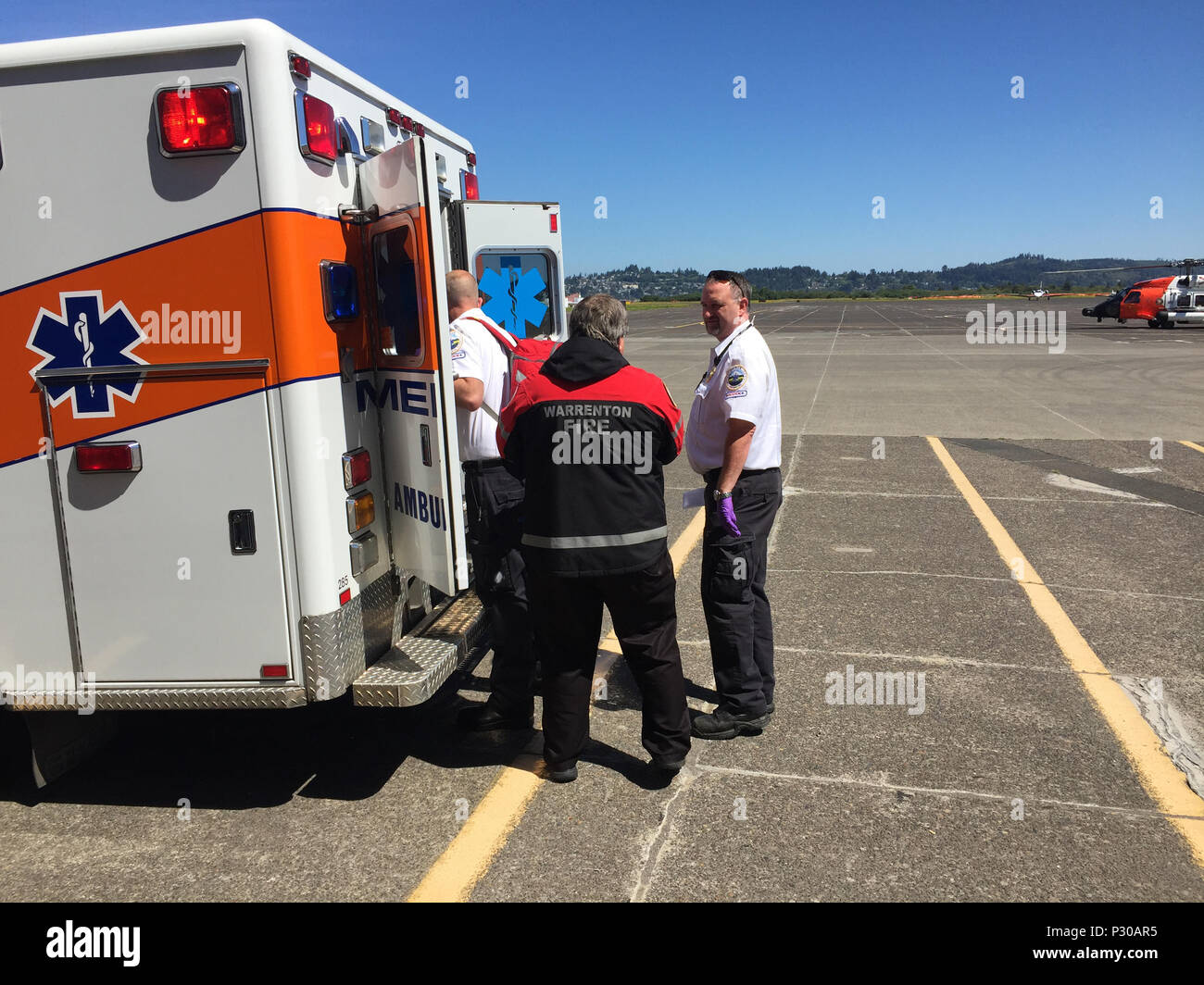Paramedics from the Warrenton, Ore., emergency medical services load an ...