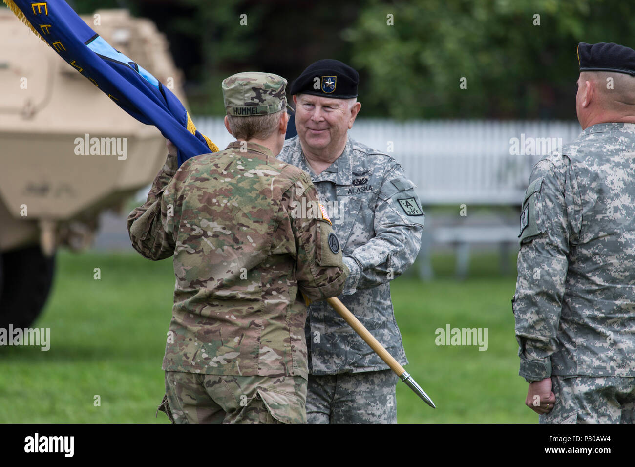 Brig. Gen. (Alaska) Roger Holl, passes the unit guidon to Brig. Gen ...