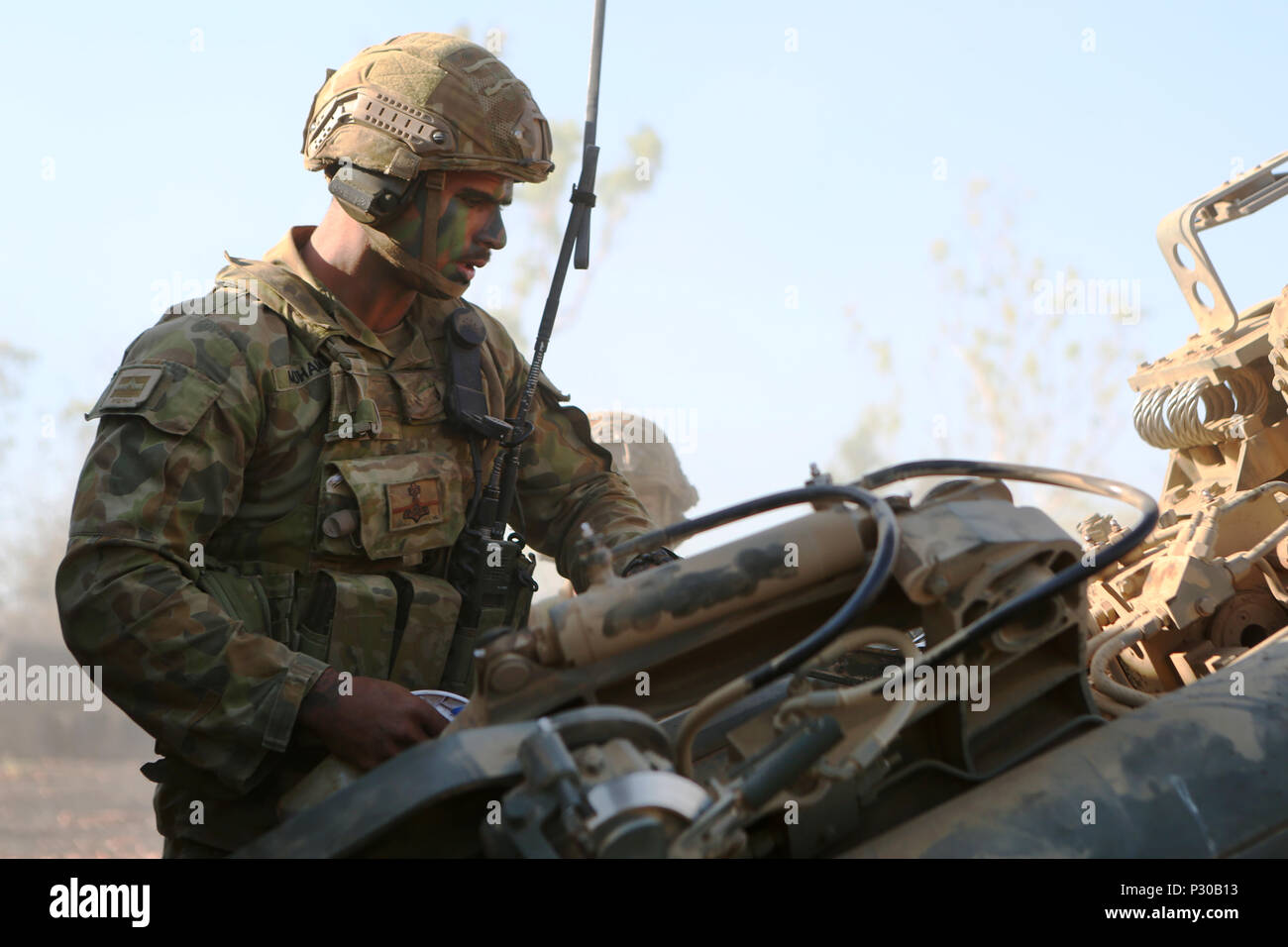 An Australian Army soldier, with 8/12 Regiment, works on an M-777 ...