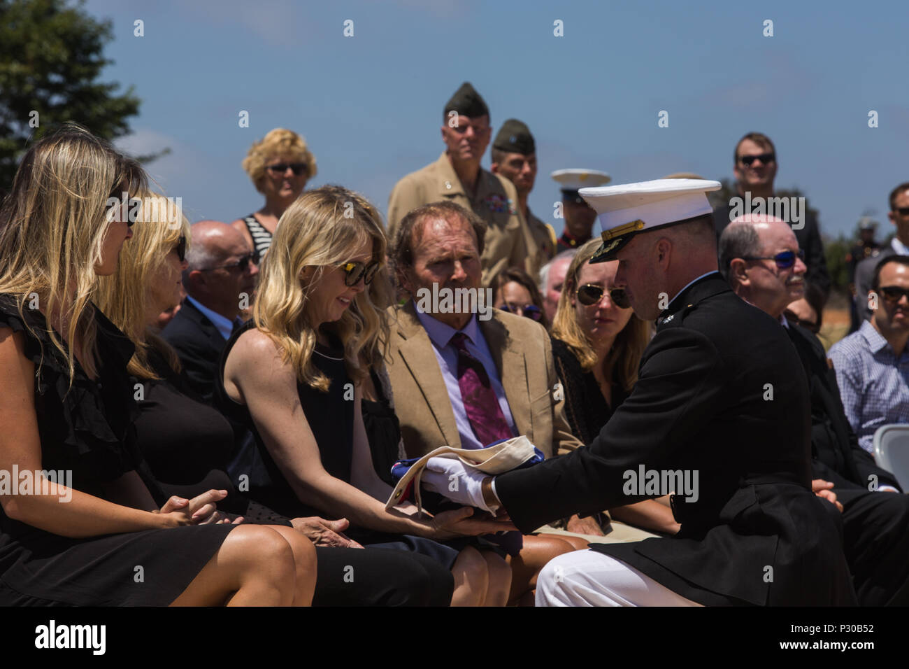 Lt. Col. Wade Workman presents the flag of Maj. R. Sterling Norton, a ...