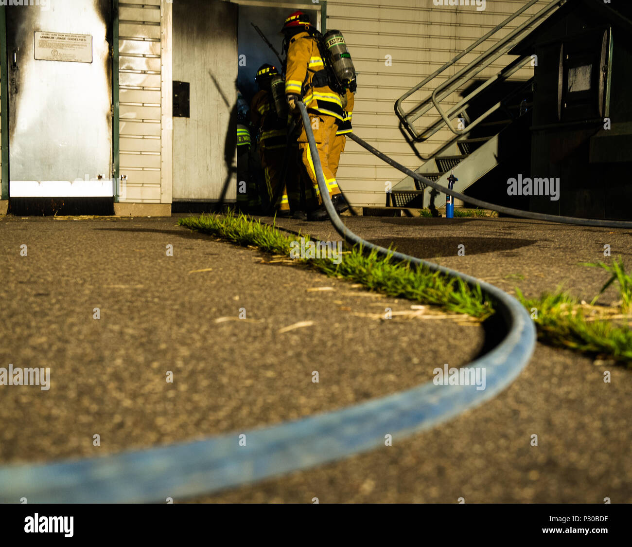 U.S. Air Force firefighters prepare to enter a live fire training ...