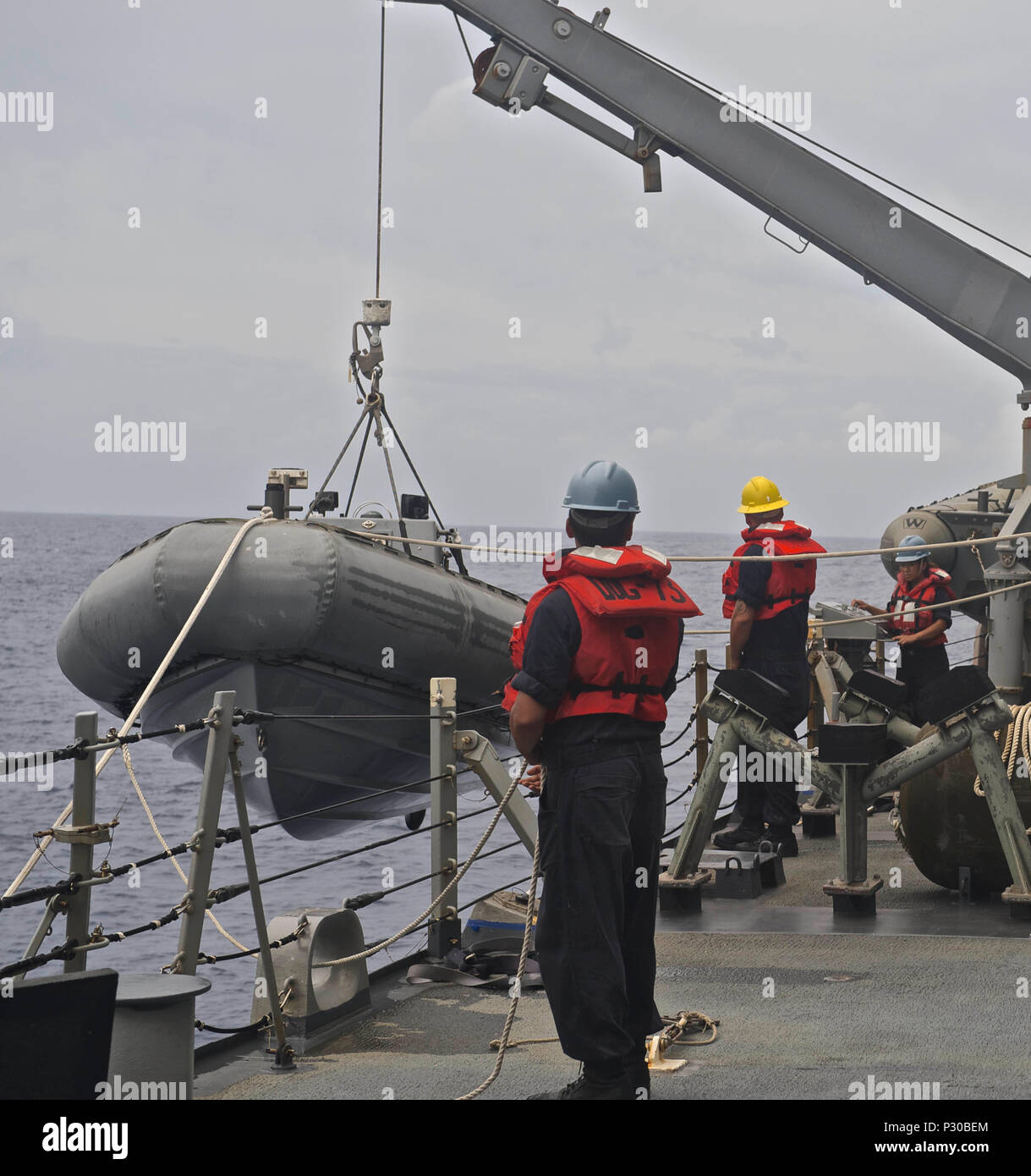 SOUTH CHINA SEA (August 9, 2016) Sailors lower a rigid hull inflatable ...