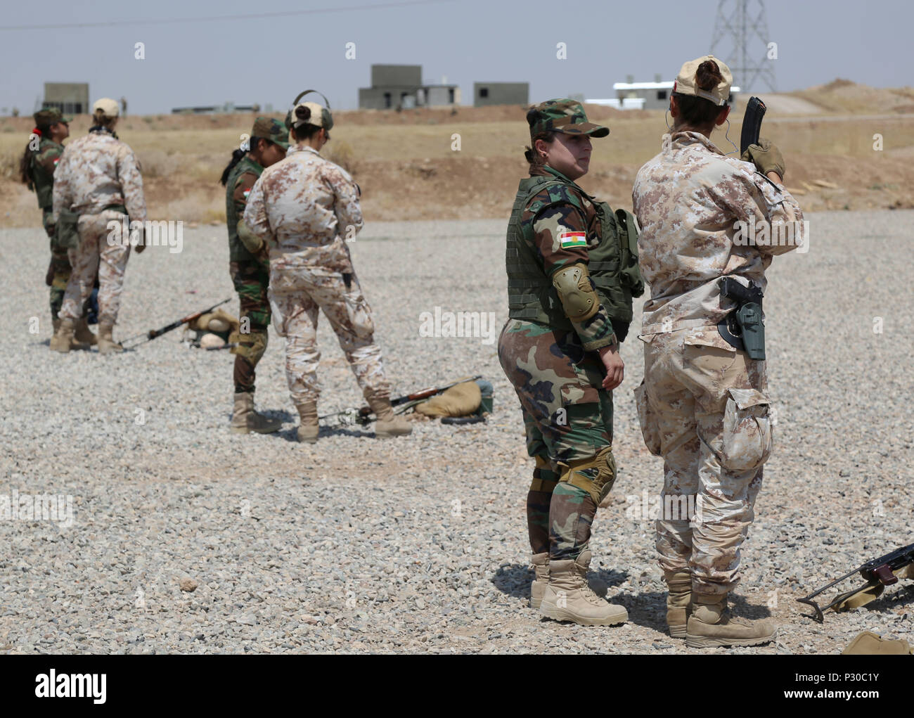 Italian trainers provide instructions to Zeravani soldiers before they ...