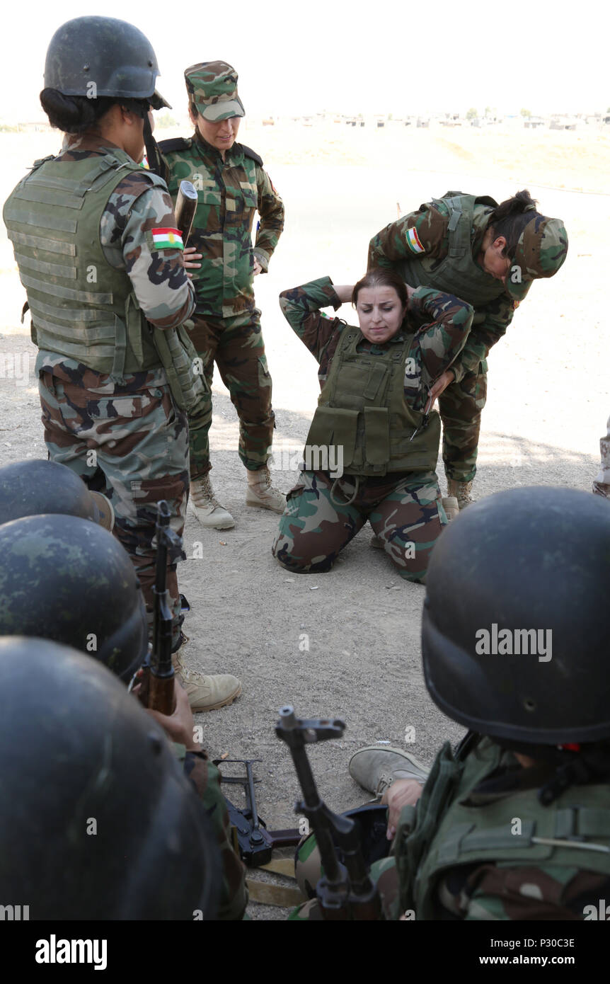Zeravani soldiers practice searching female personnel during a search ...