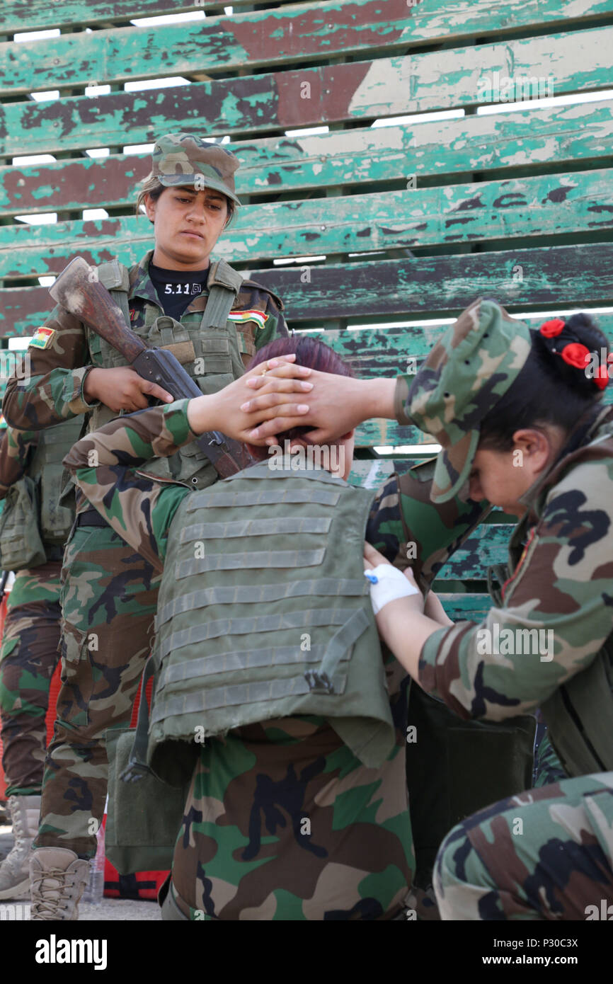 A Zeravani soldier practices pulling security as her partner searches a ...