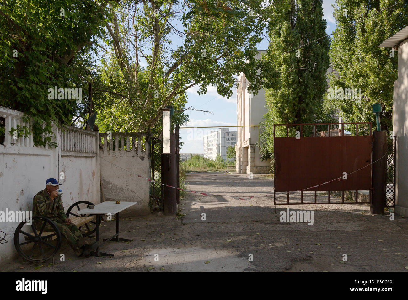 Bender, Moldova, gate to the premises of a closed factory Stock Photo ...