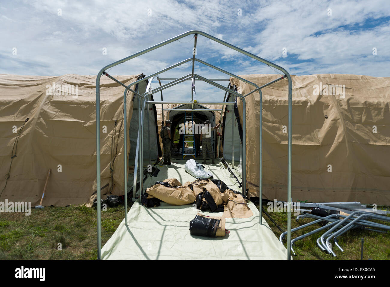 U.S. Airmen assemble the En Route Patient Staging System (ERPSS) that ...