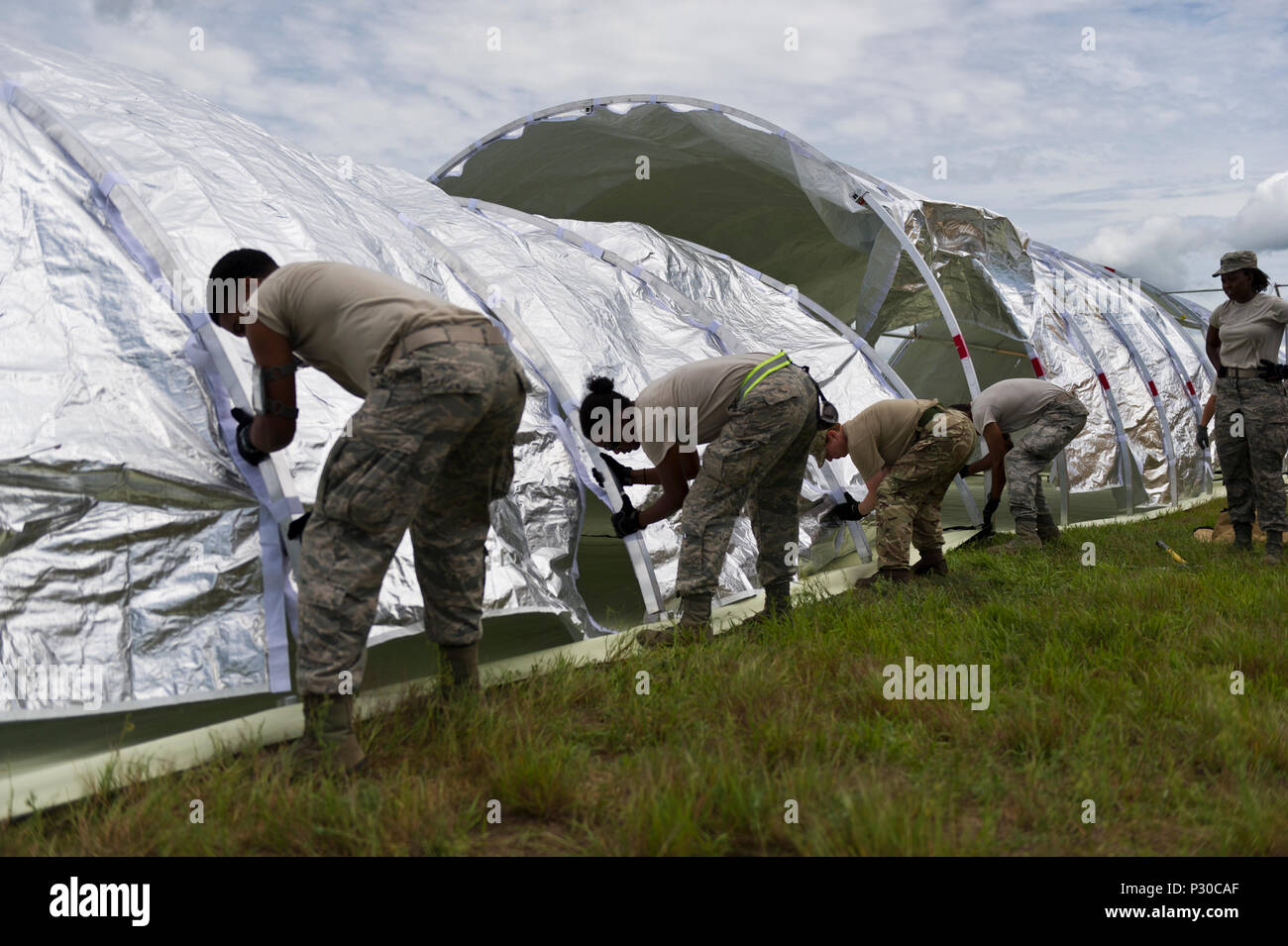 U.S. Airmen and British Royal Air Force service members work together ...