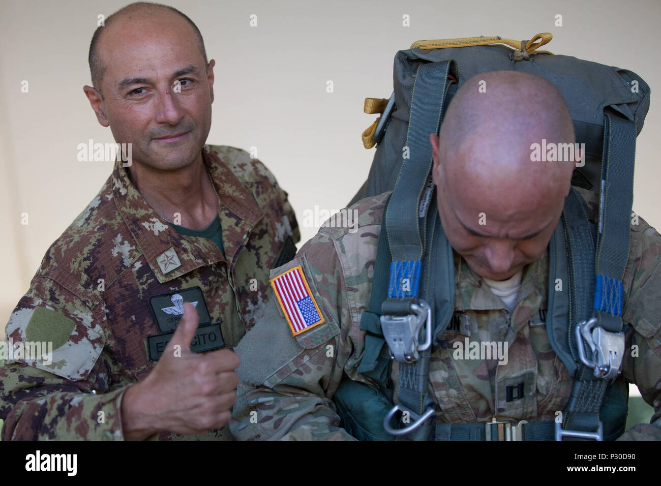 U.S. Army and Italian paratroopers buddy rig MC-6 parachutes in West ...