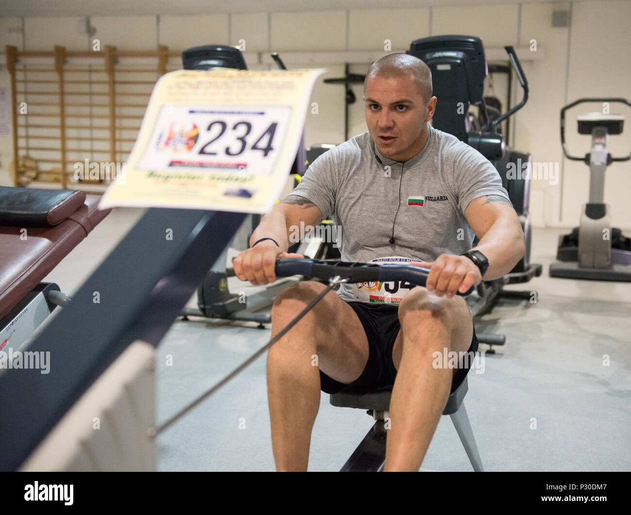 Competitors compete in the rowing leg of the NATO Role III MMU indoor ...