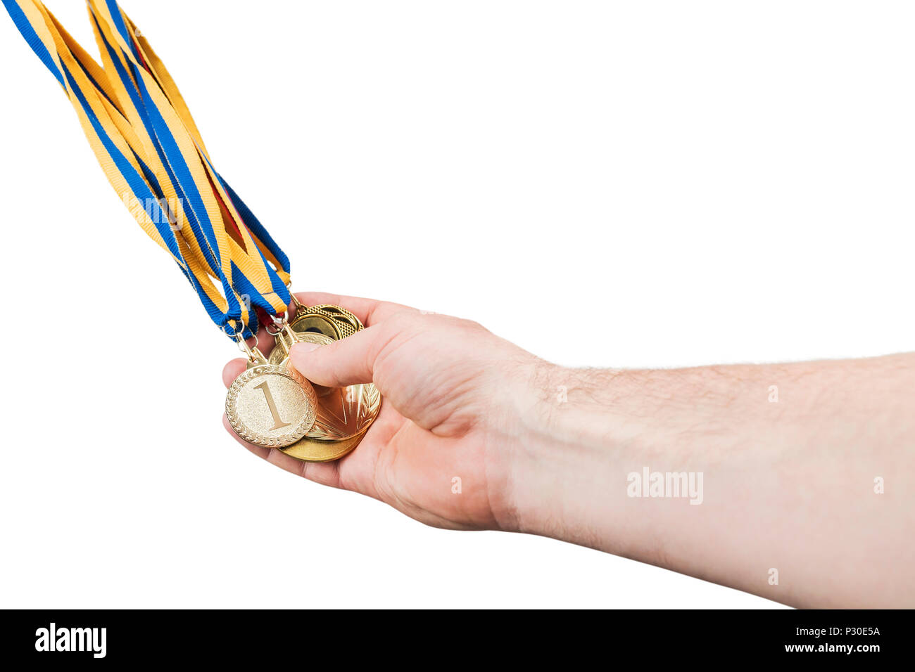 Man hand holds many medals with a ribbon, isolated on a white ...