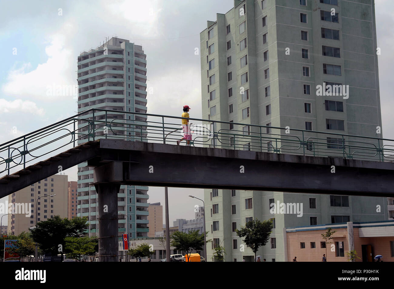 Pyongyang, North Korea, a woman on a pedestrian bridge Stock Photo - Alamy