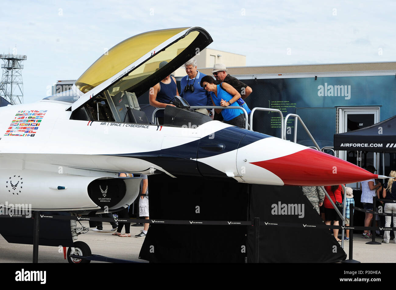Spectators observe a Thunderbird F-16 Fighting Falcon static display at ...