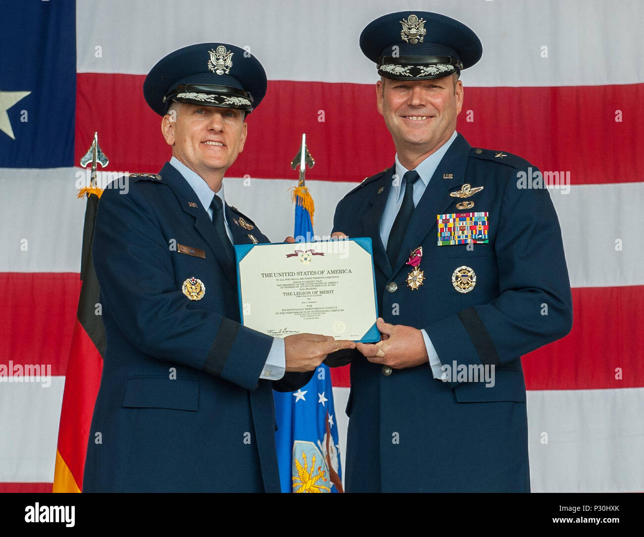 Lieutenant Gen. Timothy M. Ray, 3rd Air Force commander, left, presents ...