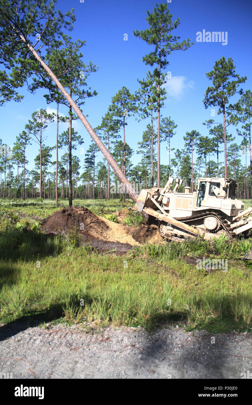 A bulldozer operator with Bravo Company, 9th Brigade Engineer Battalion ...