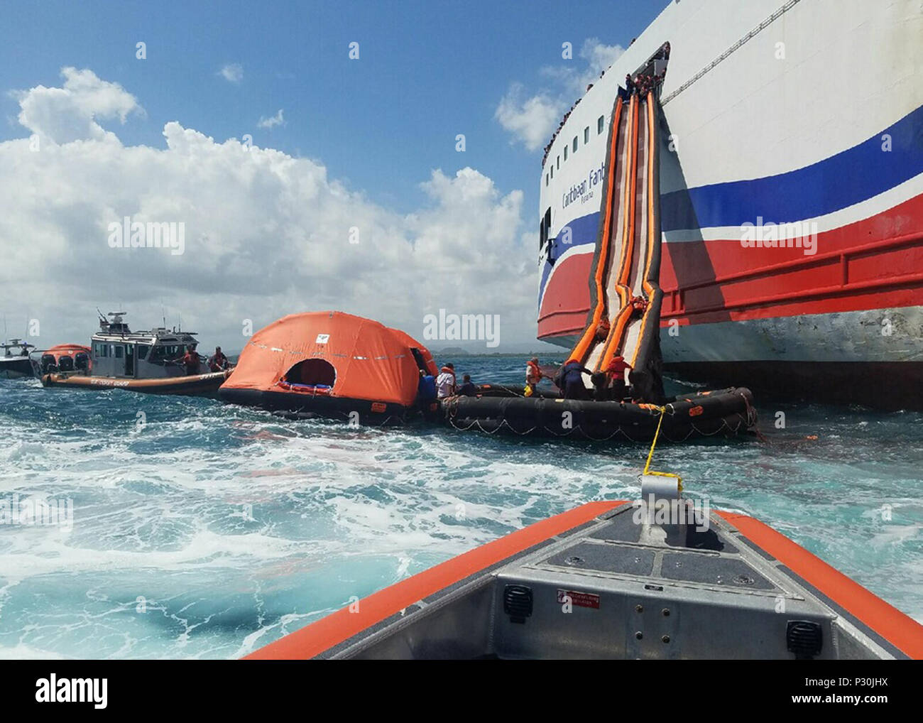 Passengers aboard the 561-foot Caribbean Fantasy ferry vessel use the ...
