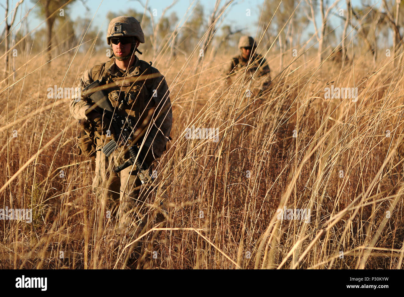 U.S. Marines with 1st Battalion, 1st Marine Regiment, walks toward a ...