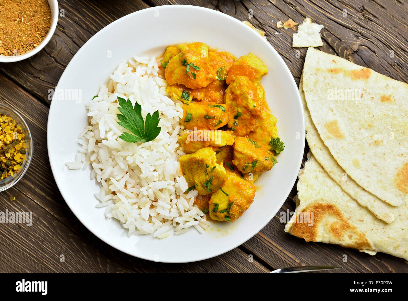 Spicy chicken curry with rice on wooden table. Top view, flat lay Stock ...