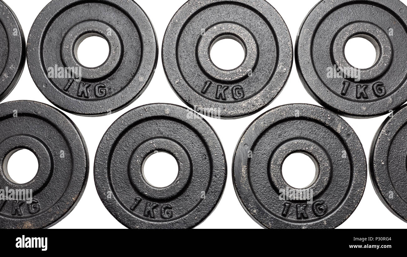 Black metal weights 1kg and 2kg on white background with clipping path ...