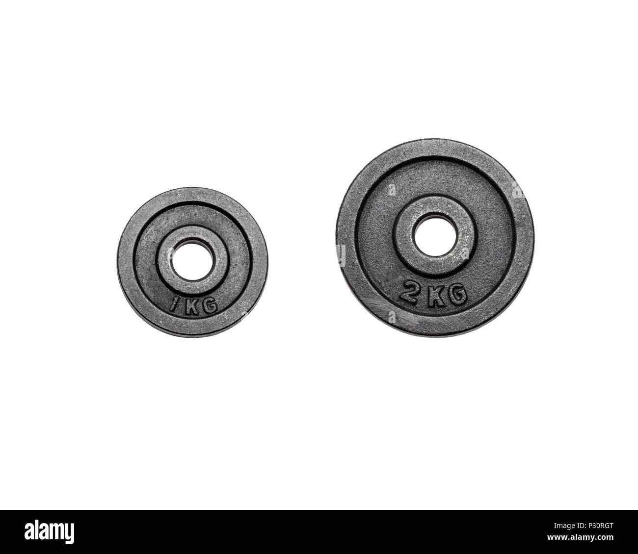Black metal weights 1kg and 2kg on white background with clipping path ...