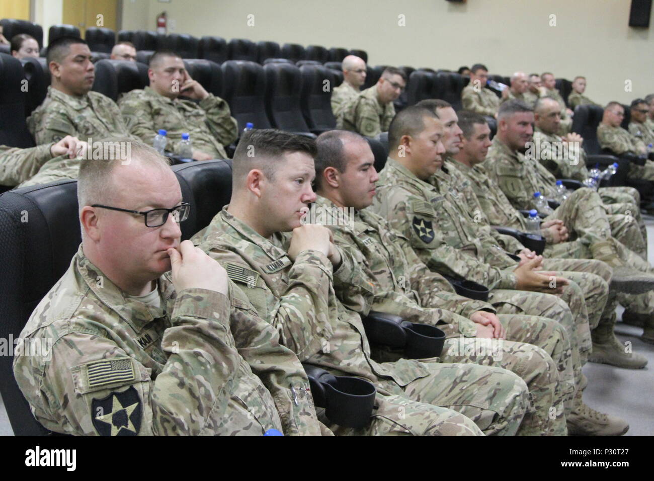 Soldiers with the 451st Expeditionary Sustainment Command listen ...