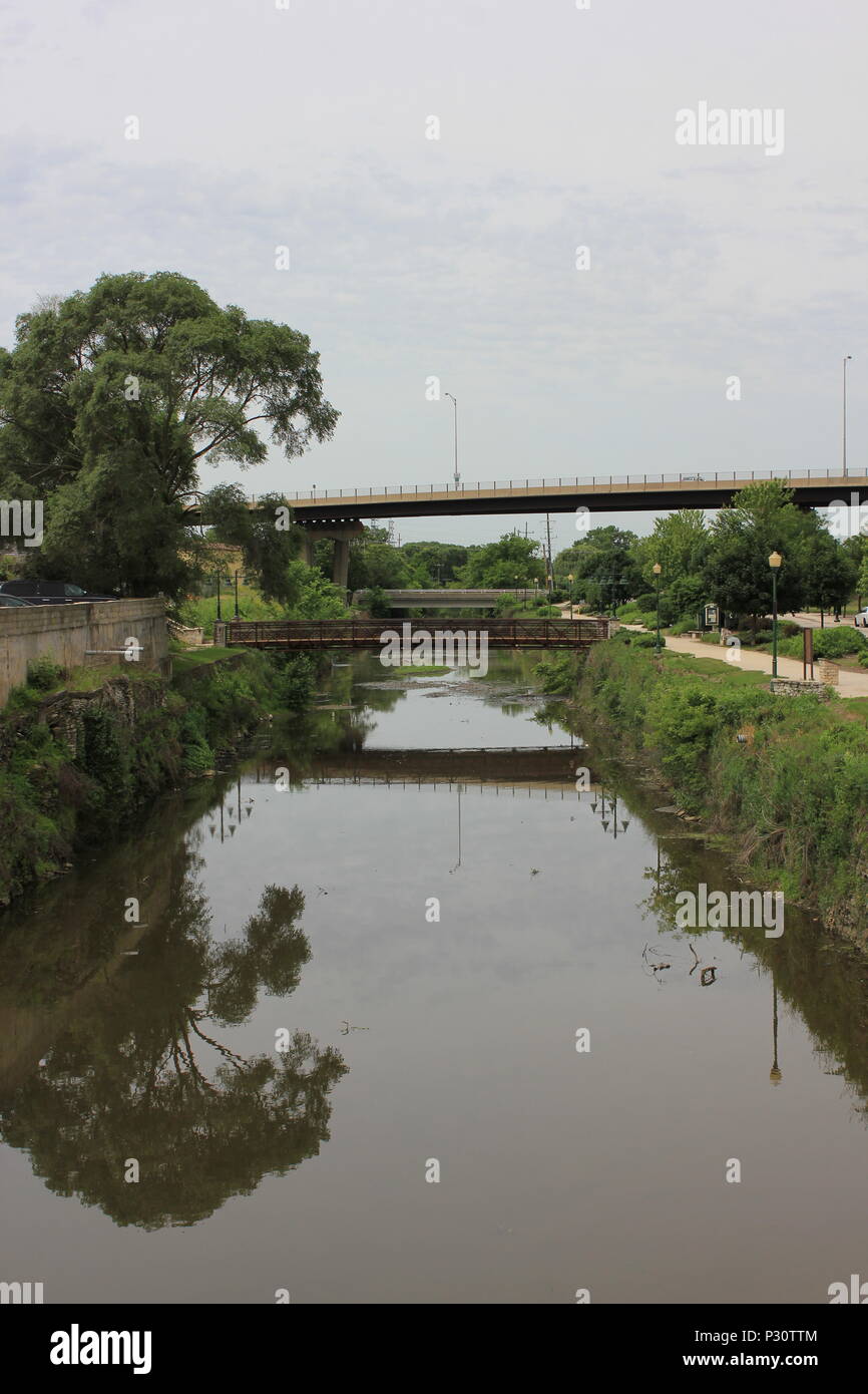 Industrial waterways under the concrete highway overpass Stock Photo ...