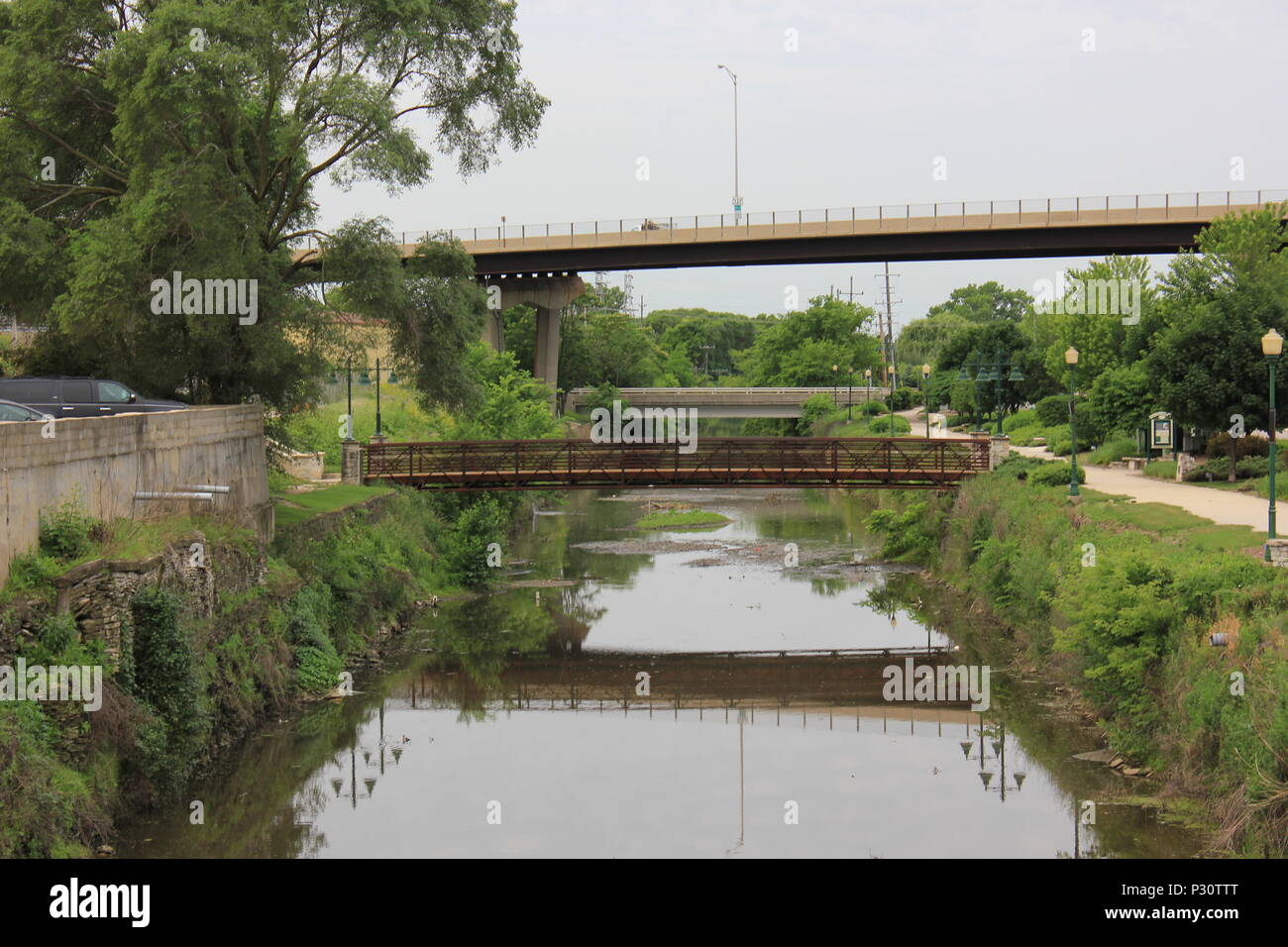 Industrial waterways under the concrete highway overpass Stock Photo ...