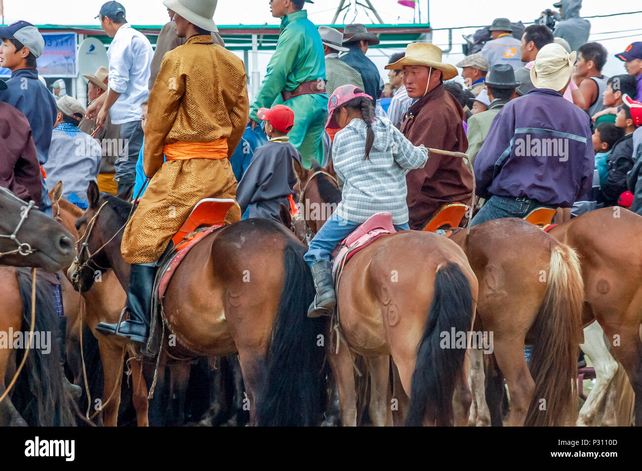 Khui Doloon Khudag, Mongolia - July 12, 2010: Horseback spectators at ...