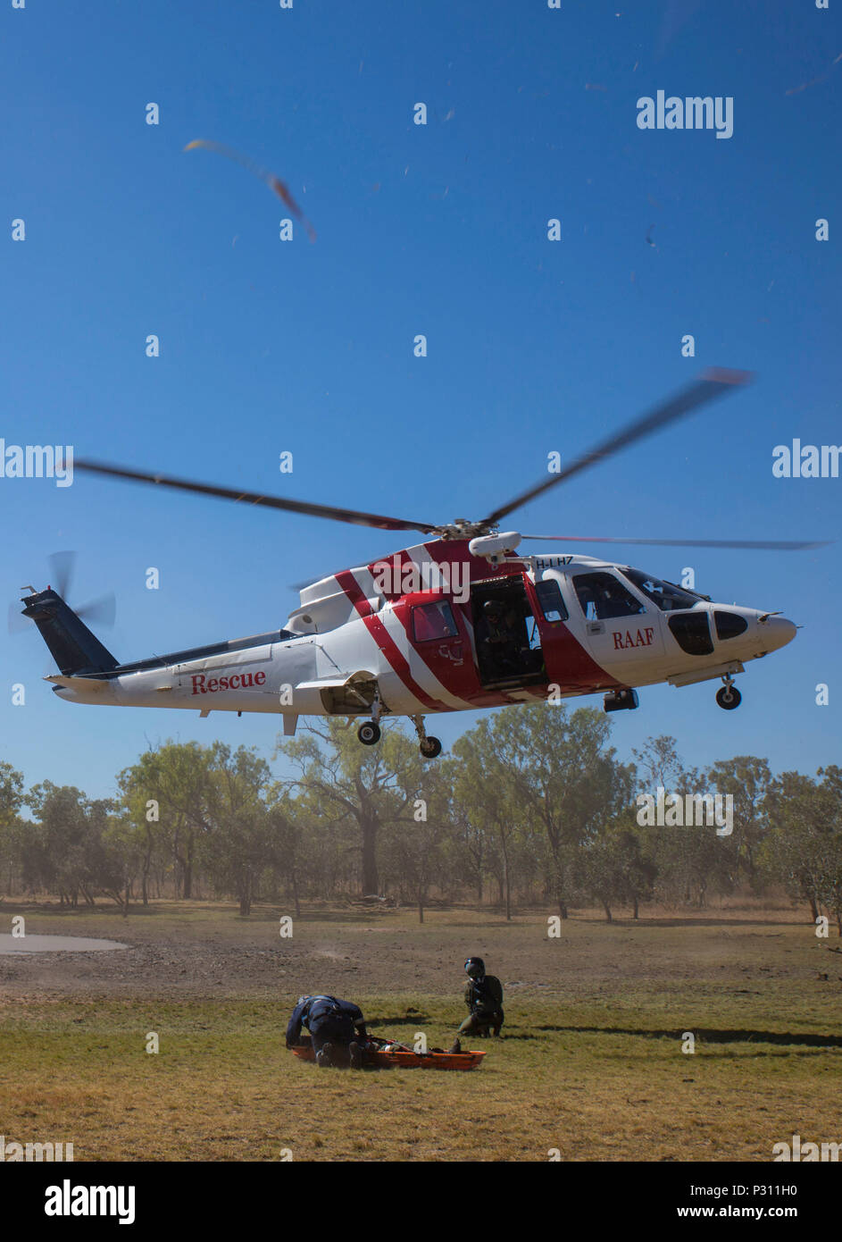 A Sikorsky S76A++ Search and Rescue helicopter approaches to hoist a ...