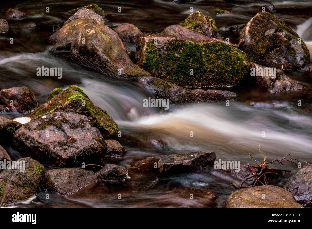 Long exposure of fast moving water in Dartmoor National Park Stock ...