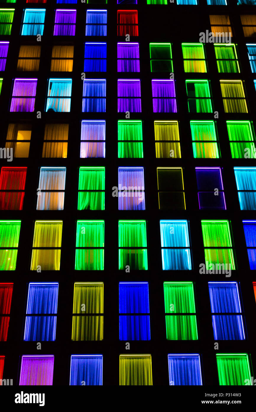Colored windows texture. Windows illuminated by neon lights background ...