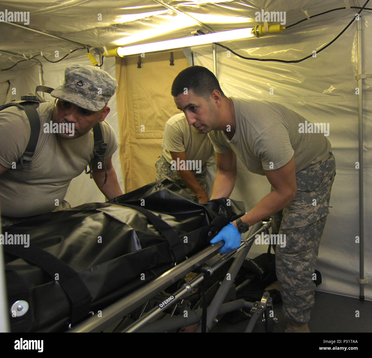 (right) US Army Reserve Spc. Reinaldo Sanchez, a mortuary affairs ...