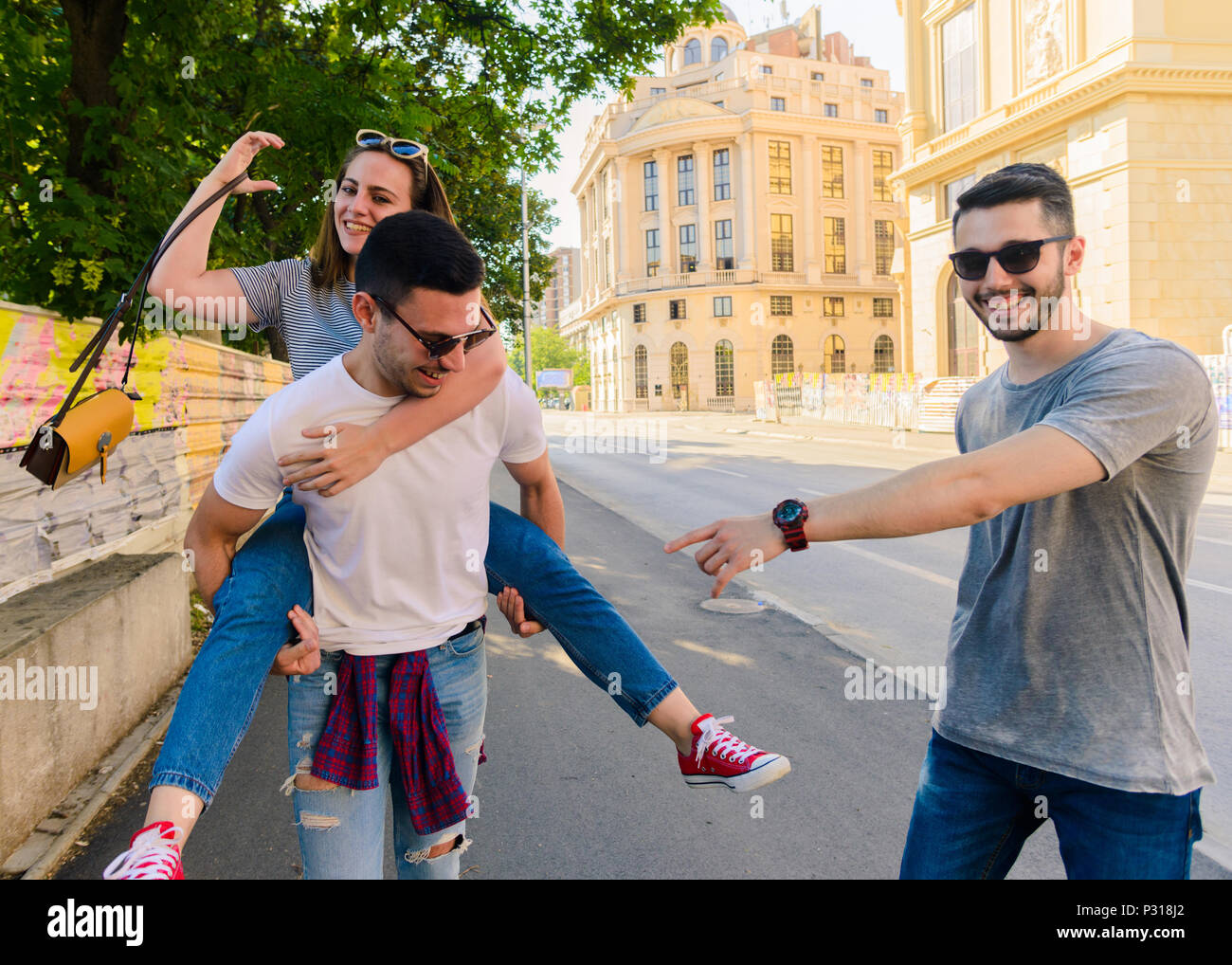 Group of friends having fun outdoors in sunny day in downtown Stock ...