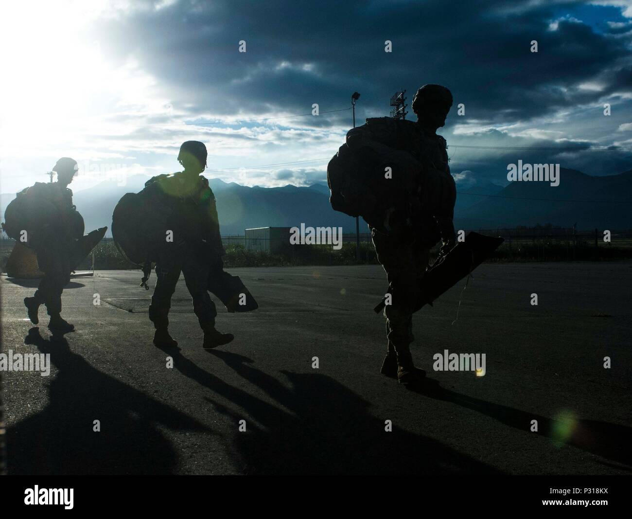 725th Brigade Support Battalion paratroopers carry combat equipment to ...