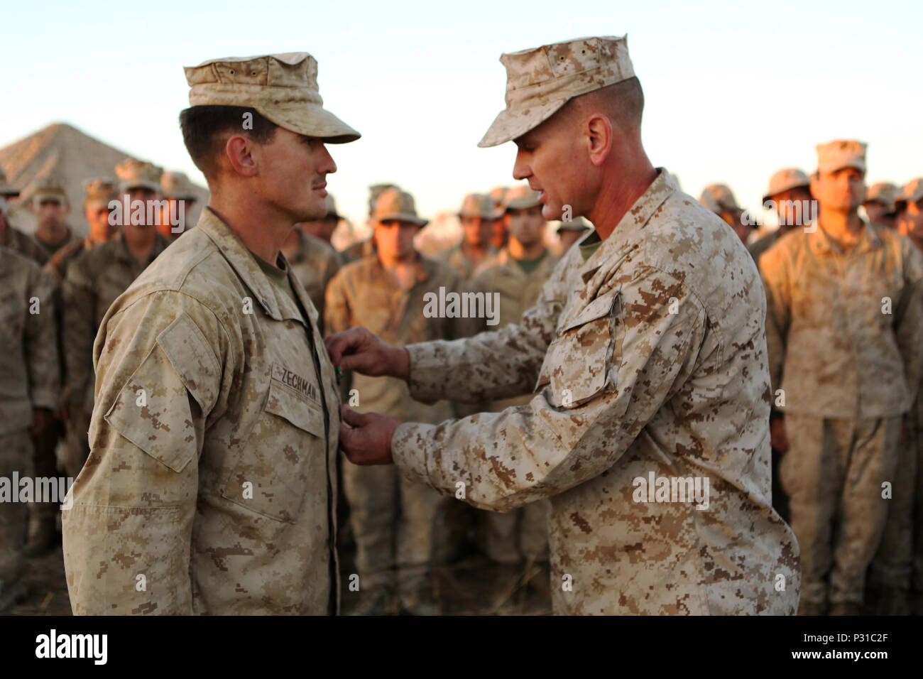 Colonel Kevin Norton, commanding officer of 4th Marine Regiment, awards ...