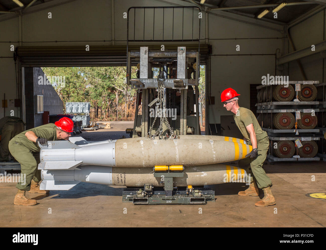 Sgt. Joel Farmer, left, aviation ordnance technician and quality ...