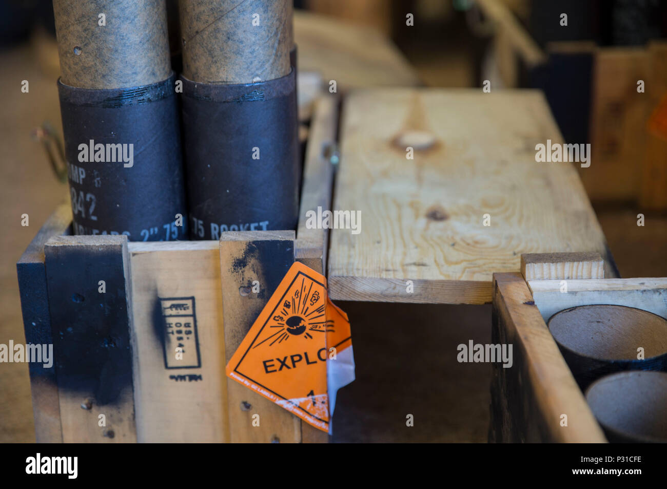 Boxes of 2.75-inch high explosive rockets wait to be assembled during ...