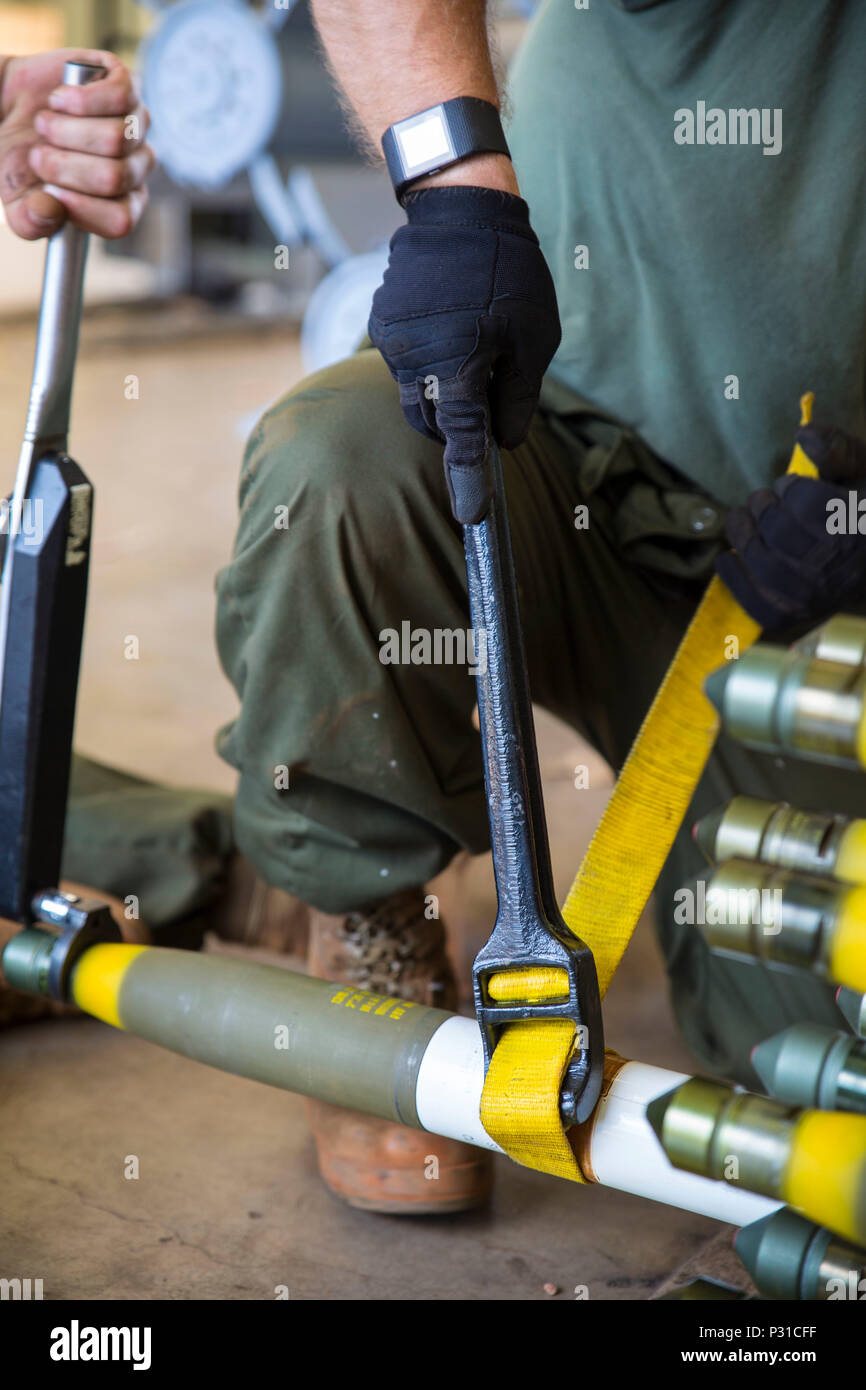 Marine Aviation Logistics Squadron 12 (MALS) Marines tighten a warhead ...