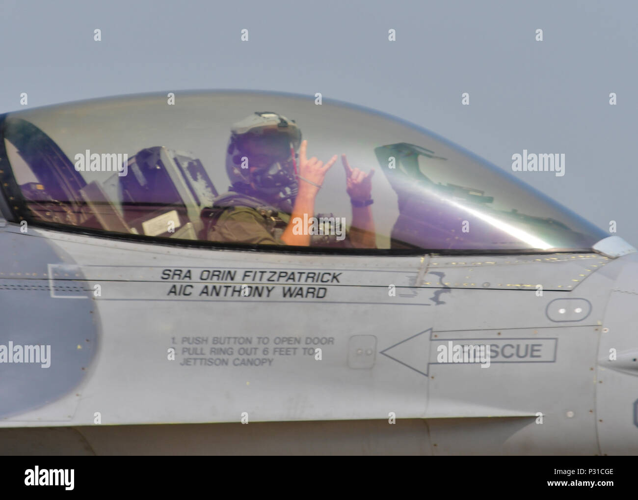 A 36th Fighter Squadron pilot shows his squadron hand-sign before a ...