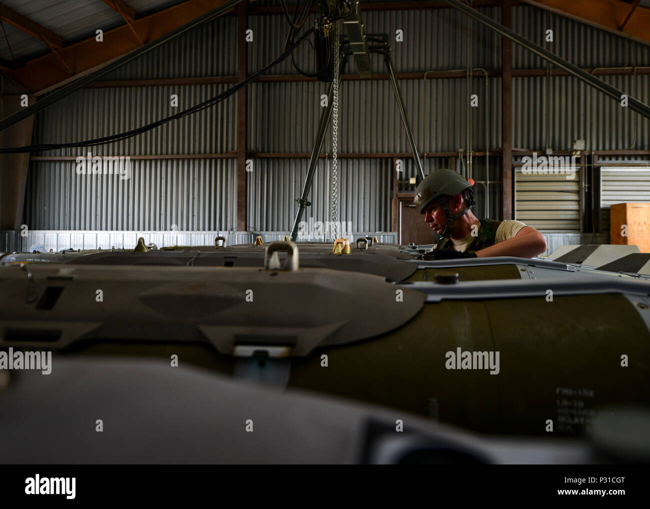 An Airman assigned to the 51st Munitions Squadron inspects a joint ...