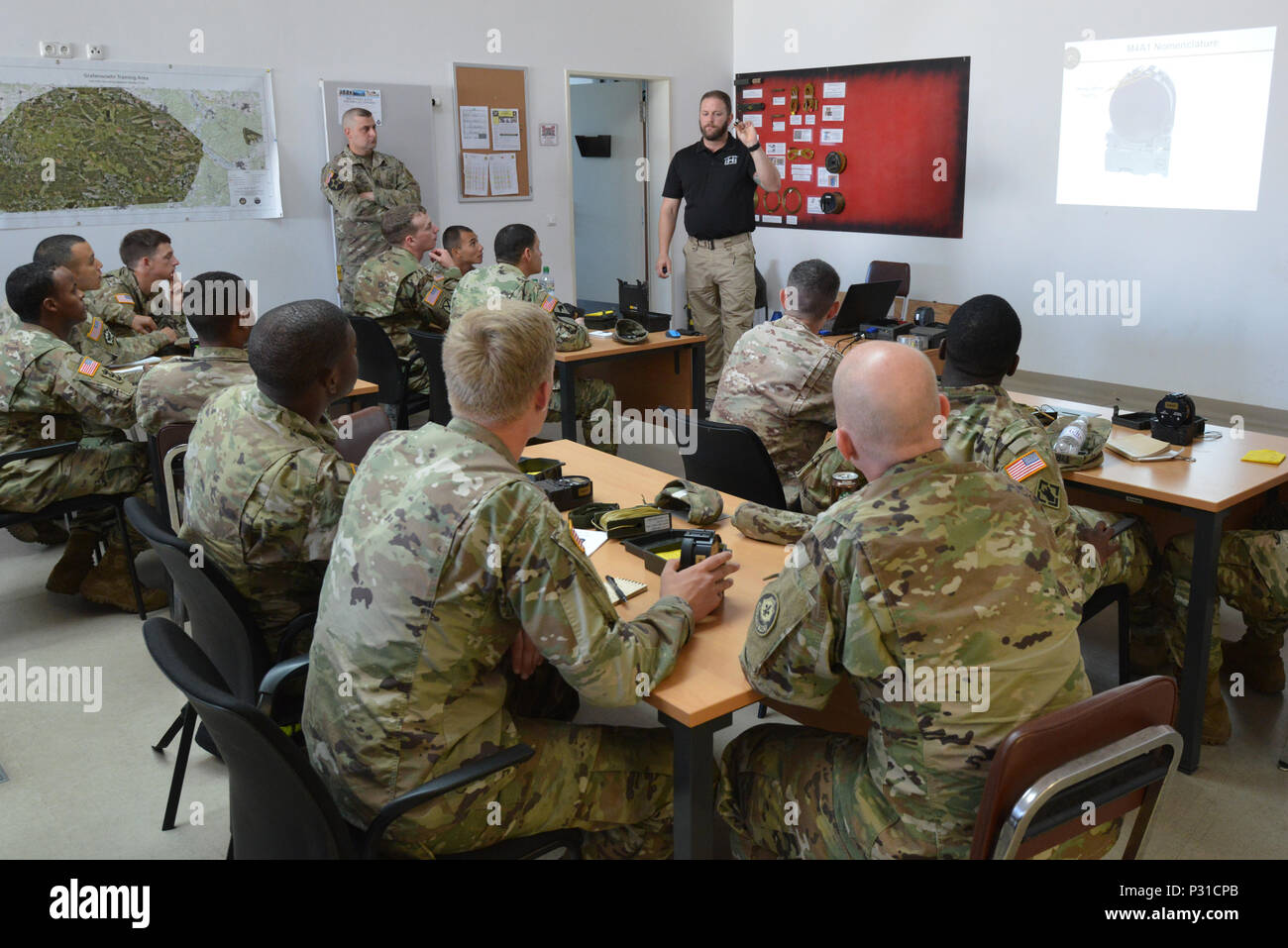 John Phillips, standing right, a New Equipment Training Instructor ...