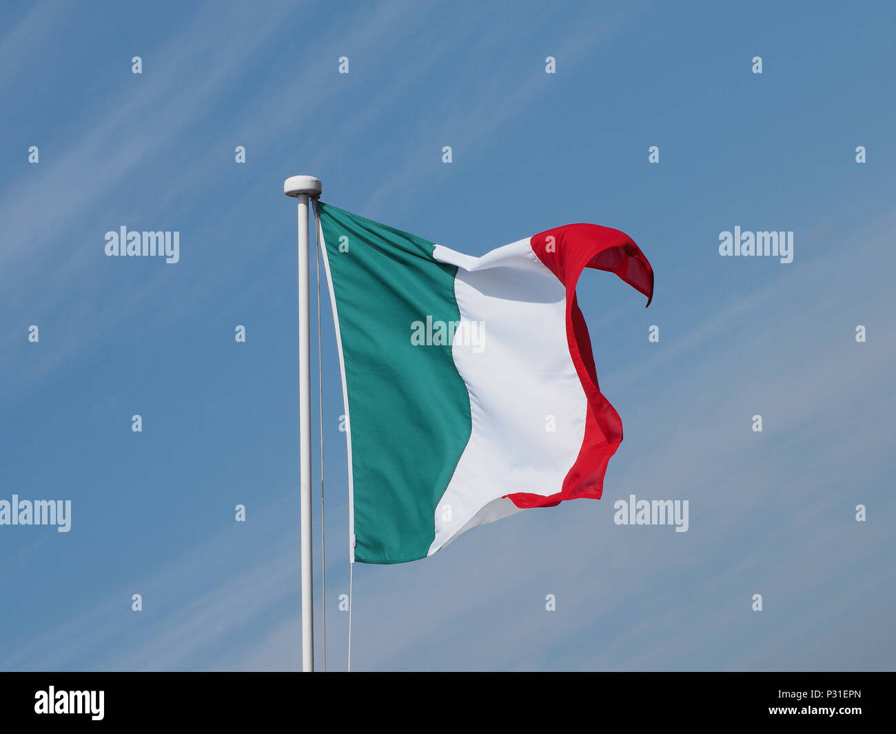the Italian national flag of Italy, Europe over blue sky Stock Photo ...