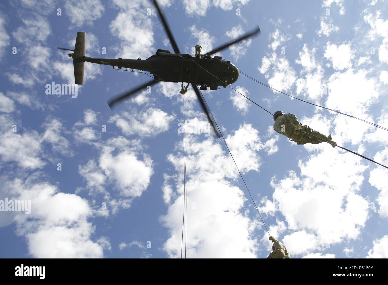 Students rappel from a UH-60 Black Hawk helicopter during Air Assault ...