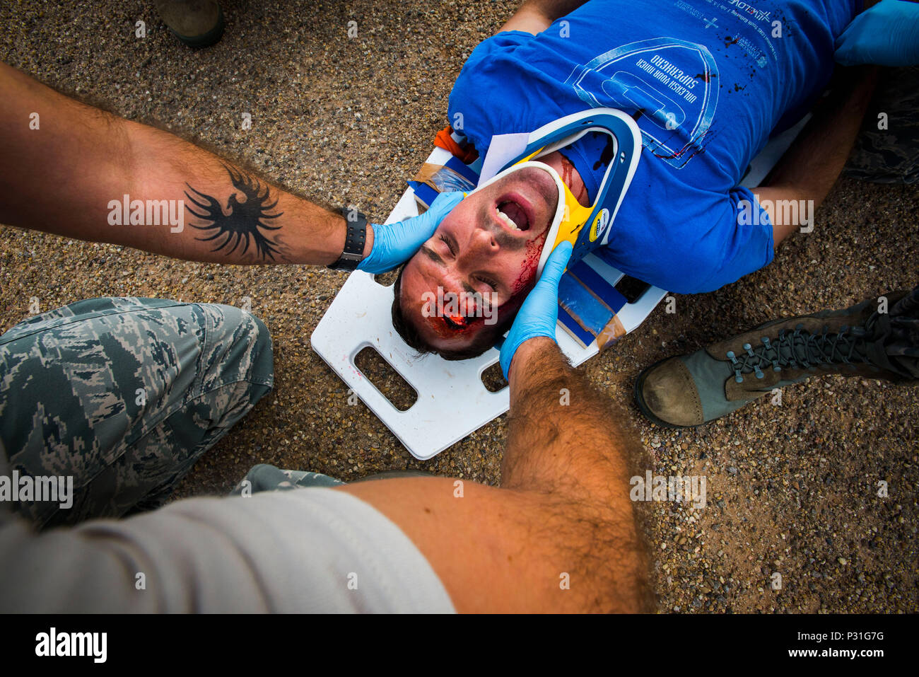 Emergency Medical Technicians from Offutt Air Force Base, Neb., treat a ...