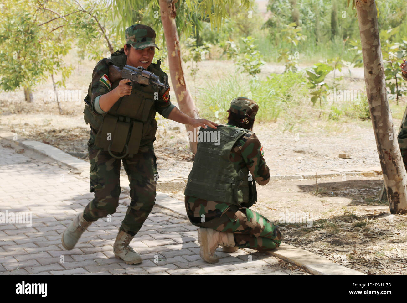 A Zeravani soldier conducts a tactical withdrawal movement during squad ...