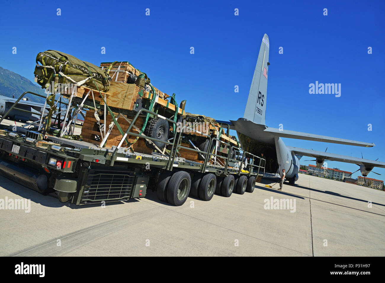 U.S. Airmen load parachute-rigged High Mobility Multipurpose Wheeled ...