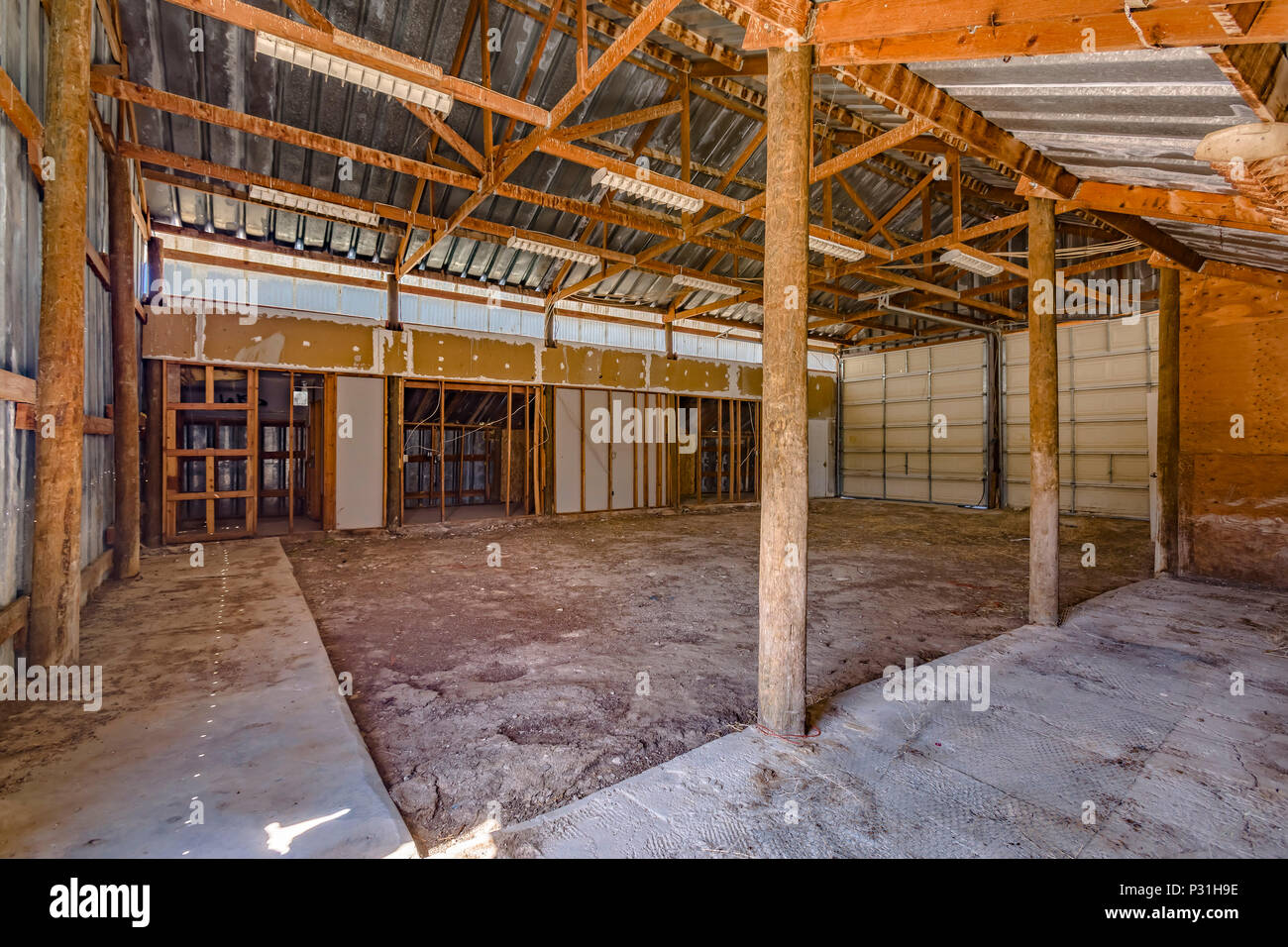 Interior of barn with wooden beams and large storage space Stock Photo ...