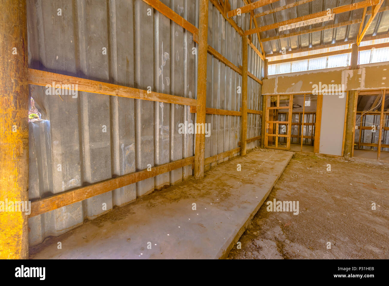 Interior side wall of barn with wood beams and metal walls Stock Photo ...