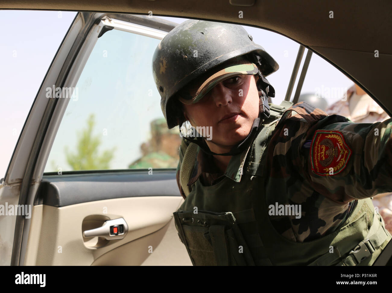 A Zeravani soldier searches a vehicle during a checkpoint training ...